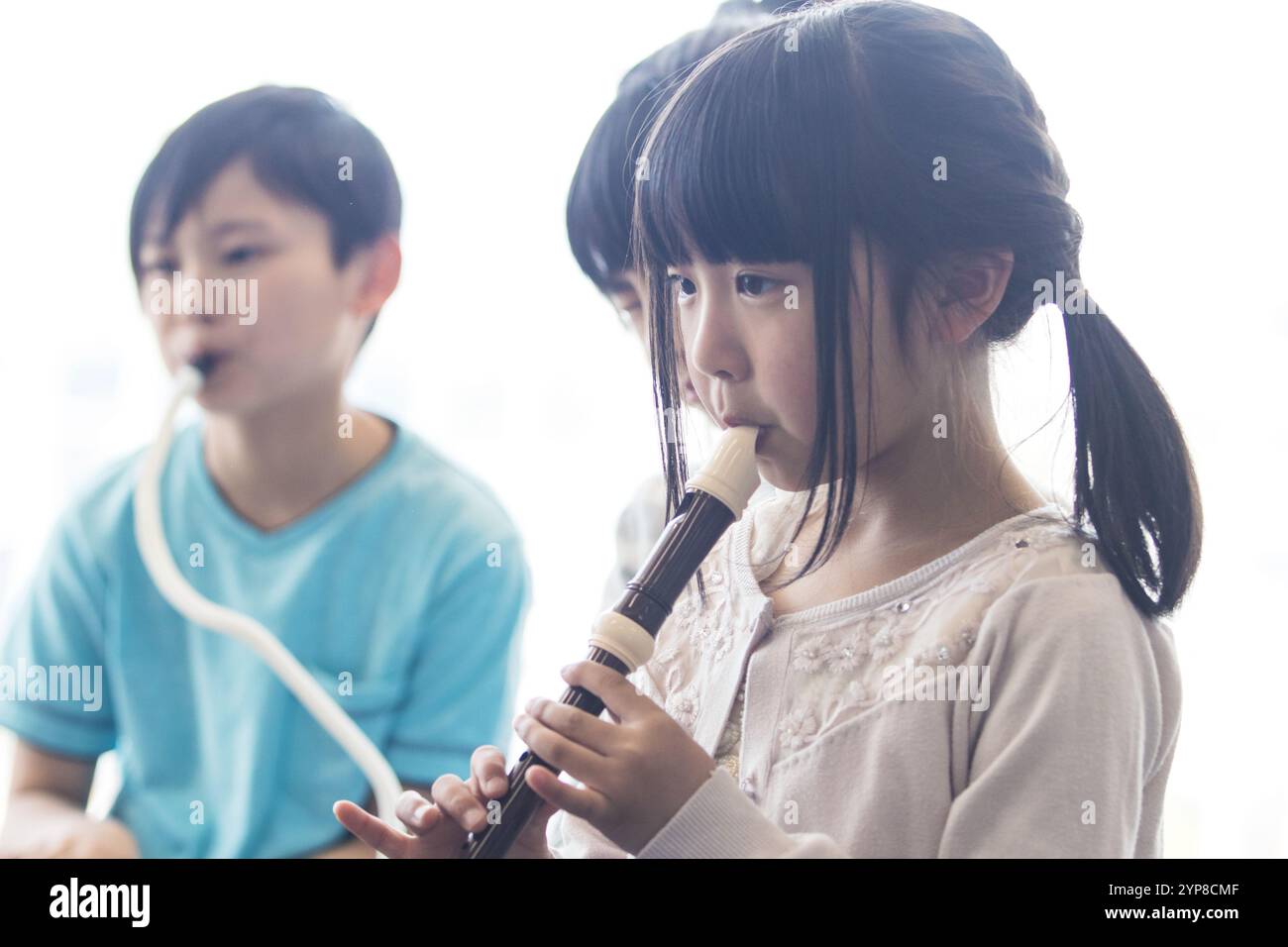 Primary school children taking music lessons Stock Photo - Alamy