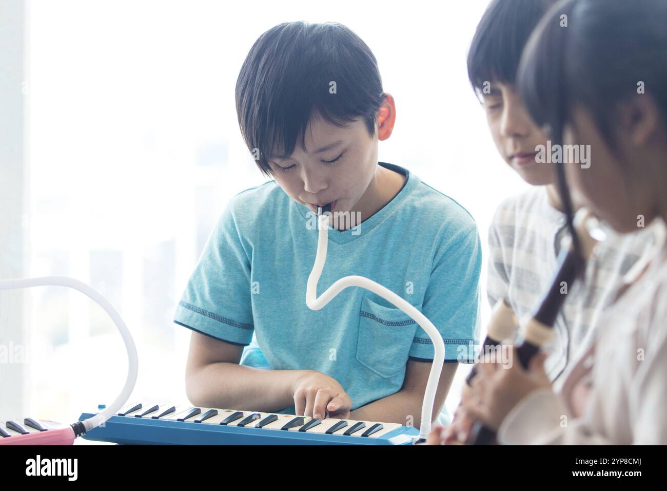 Primary school children taking music lessons Stock Photo - Alamy