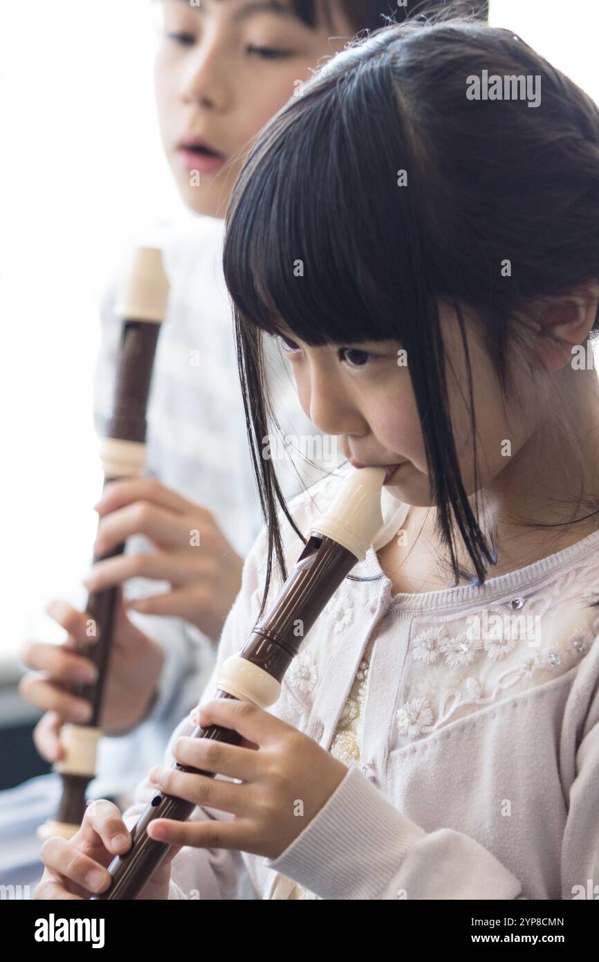 Primary school children taking lessons in the music room Stock Photo ...