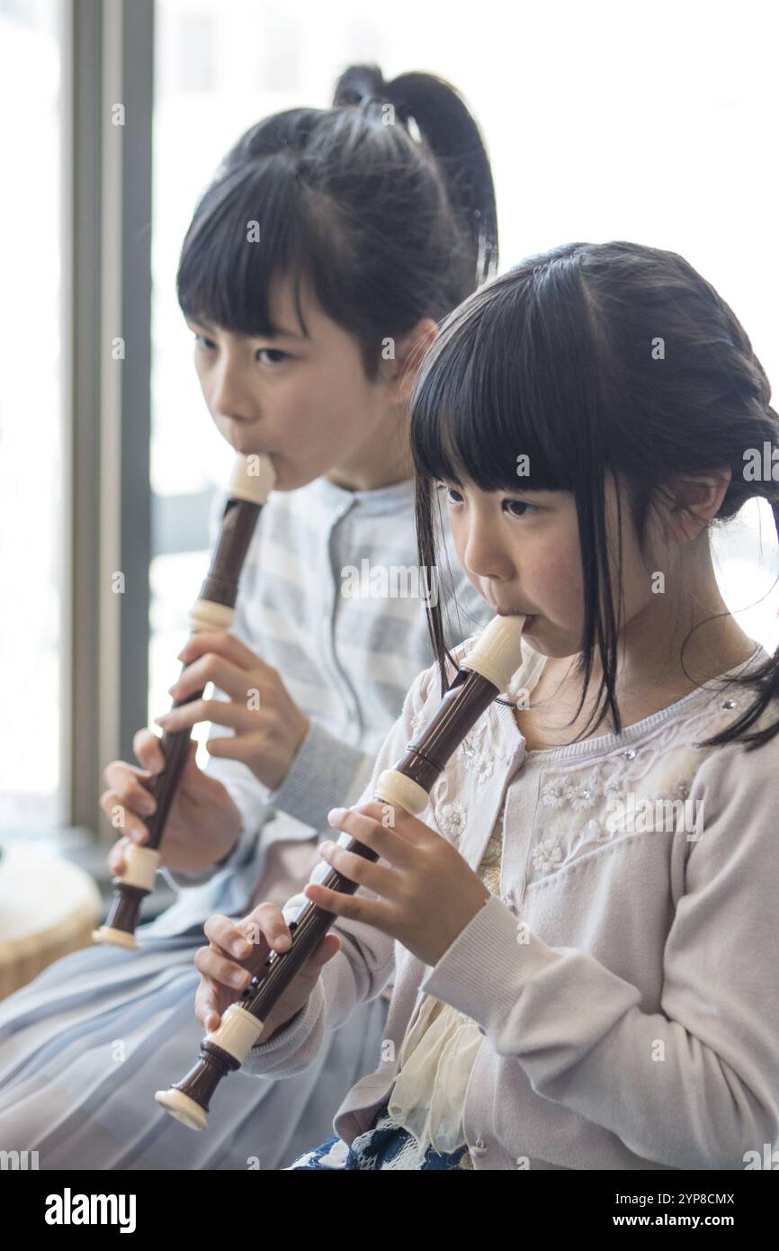 Primary school children taking music lessons Stock Photo - Alamy