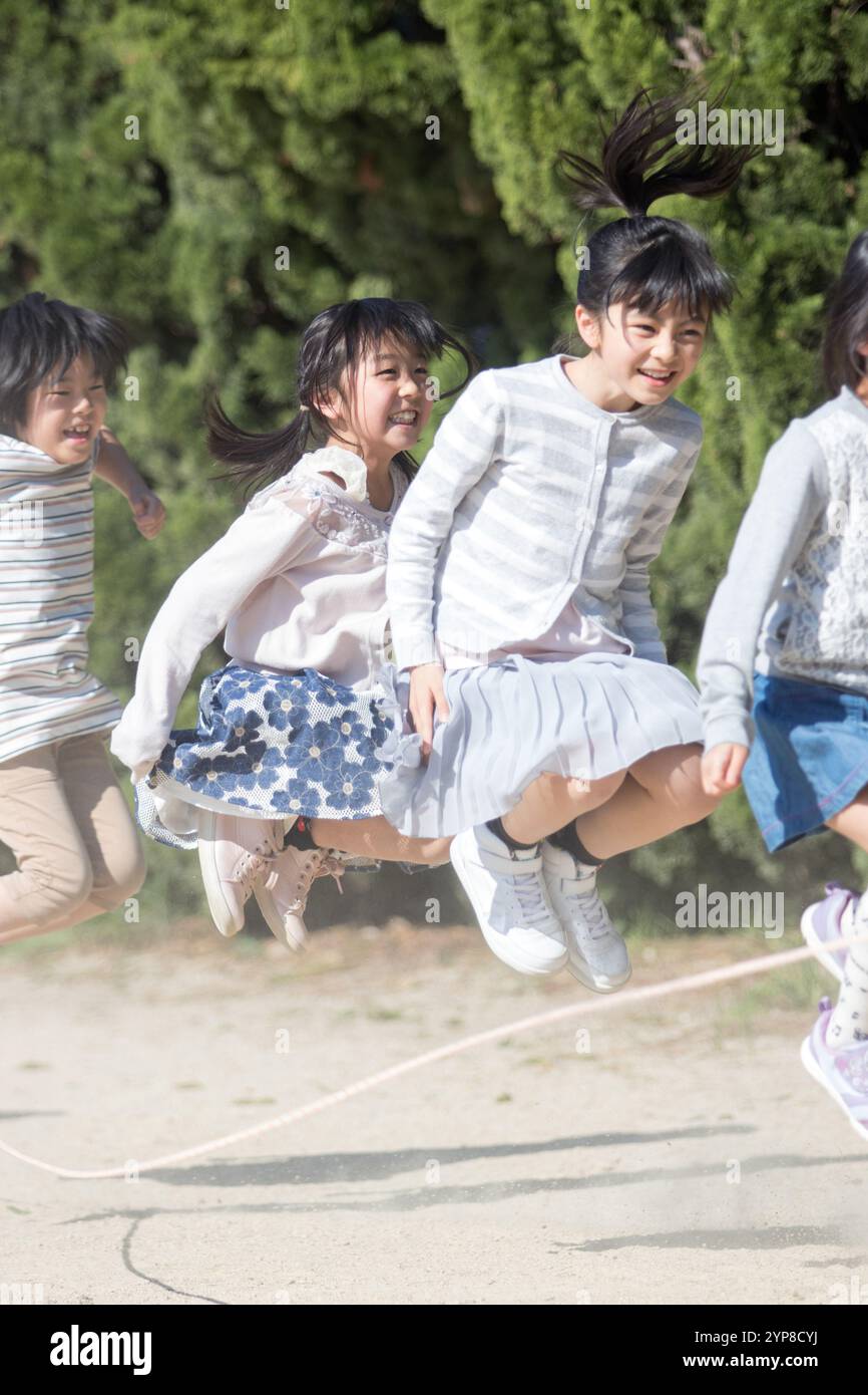 Children skipping rope hi-res stock photography and images - Alamy