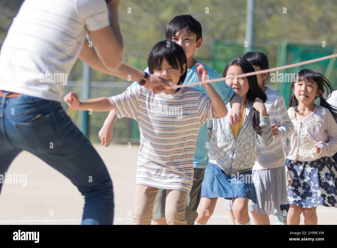 Primary school children jumping rope Stock Photo - Alamy