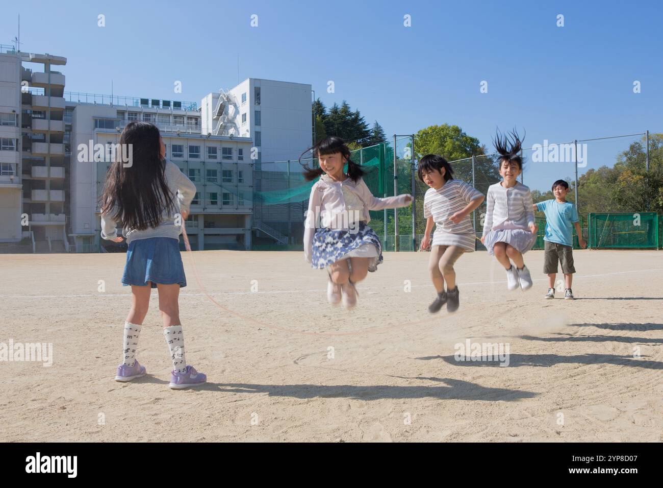 School girl skipping rope hi-res stock photography and images - Alamy