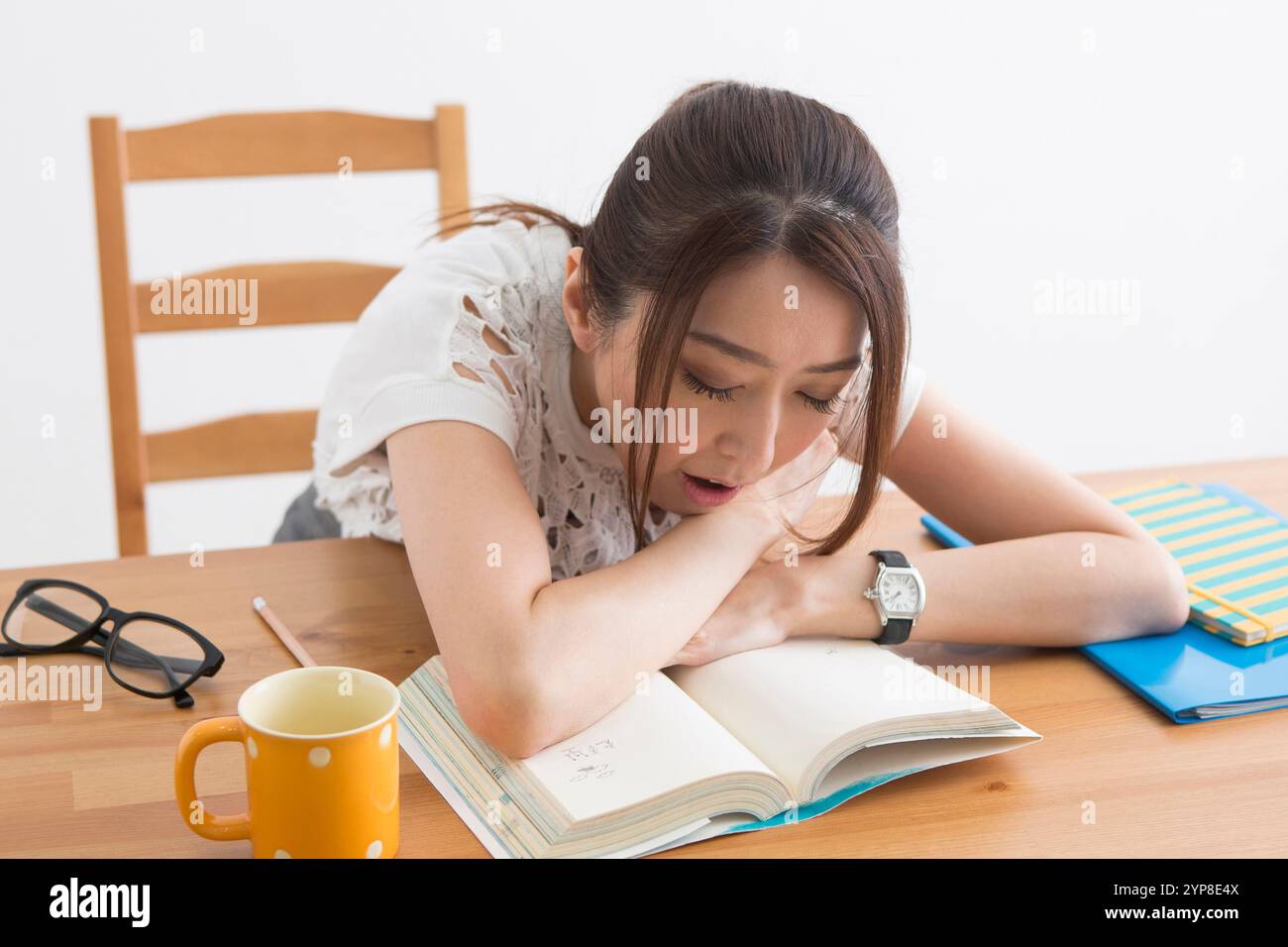 Dozing with book hi-res stock photography and images - Alamy
