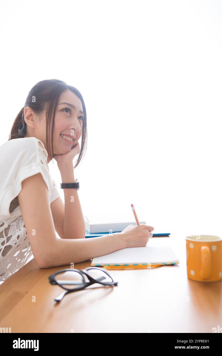 Woman taking notes Stock Photo - Alamy