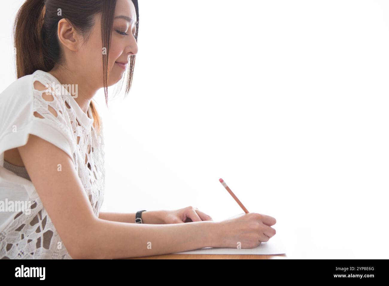 Woman taking notes Stock Photo - Alamy