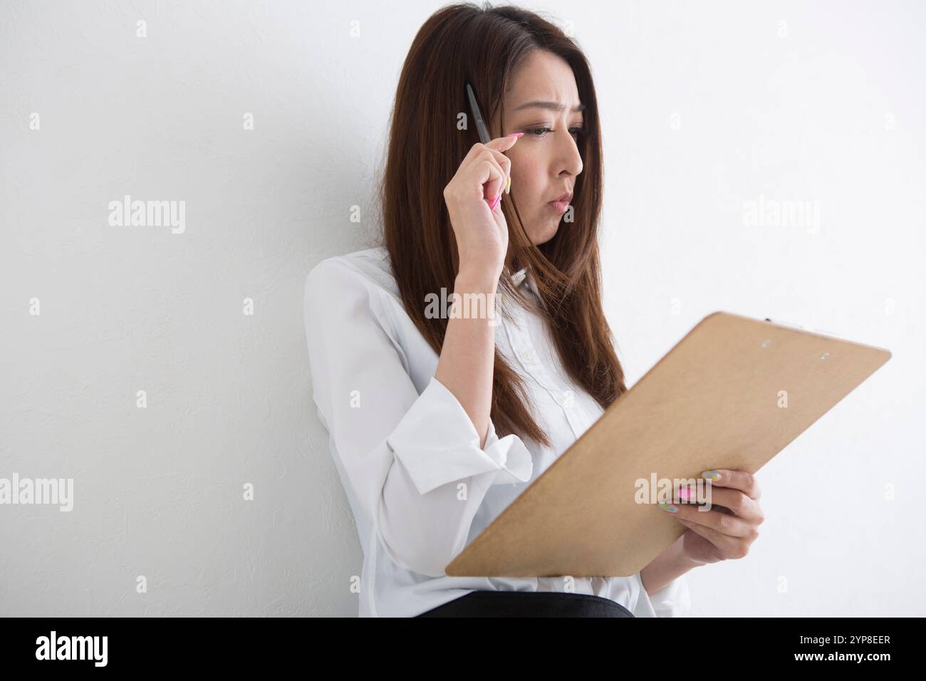 Woman taking notes Stock Photo - Alamy