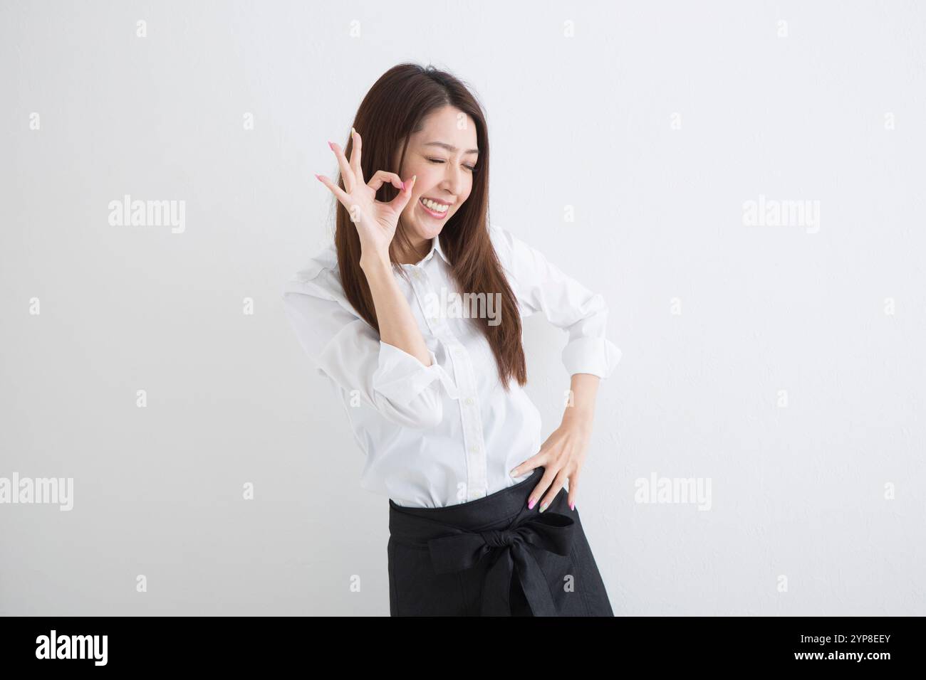Woman giving the ‘ok’ sign Stock Photo - Alamy