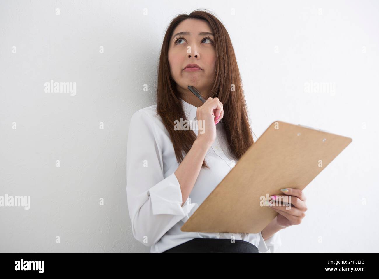 Woman taking notes Stock Photo - Alamy