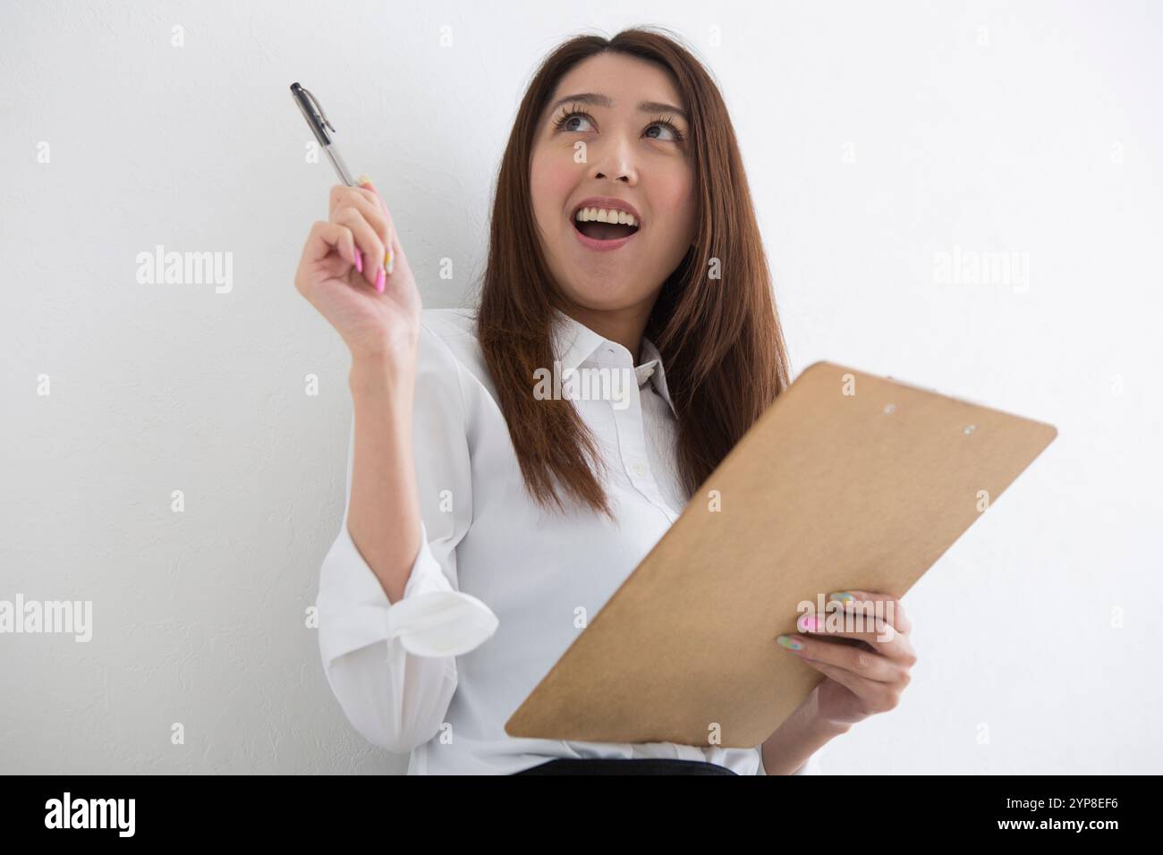 Woman taking notes Stock Photo - Alamy
