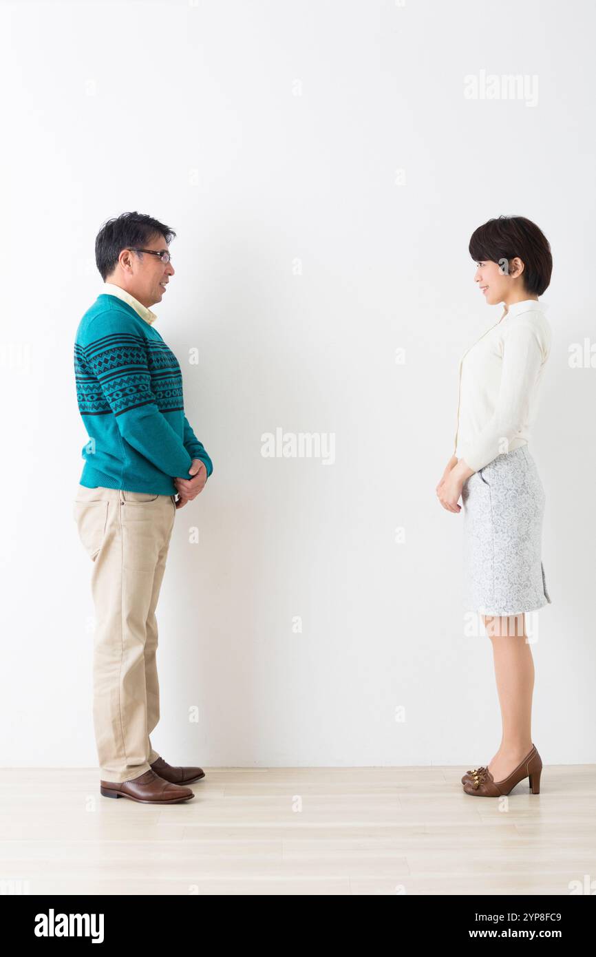 Couple standing face to face whole body hi-res stock photography and ...