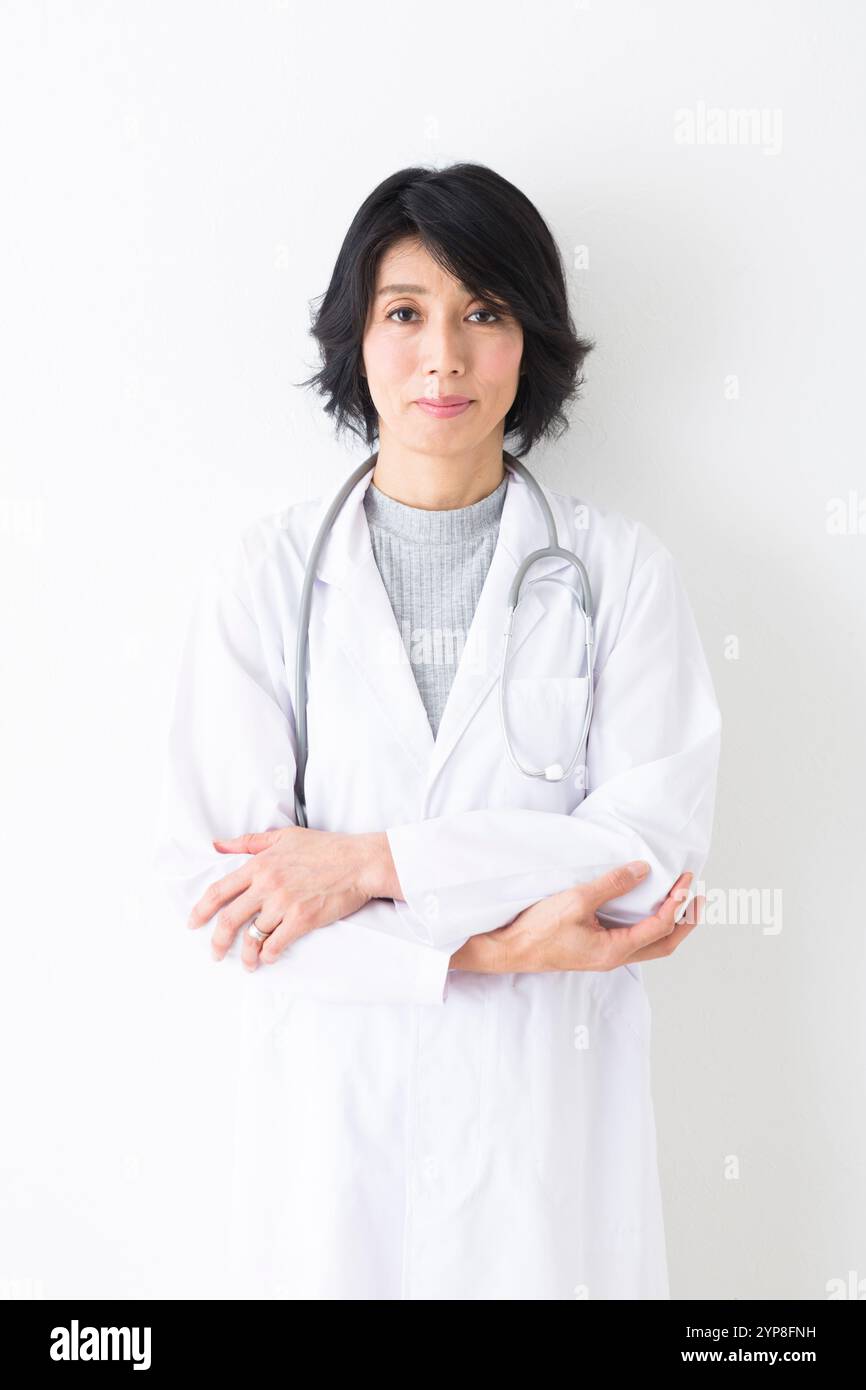 Portrait mature female doctor arms hi-res stock photography and images - Alamy