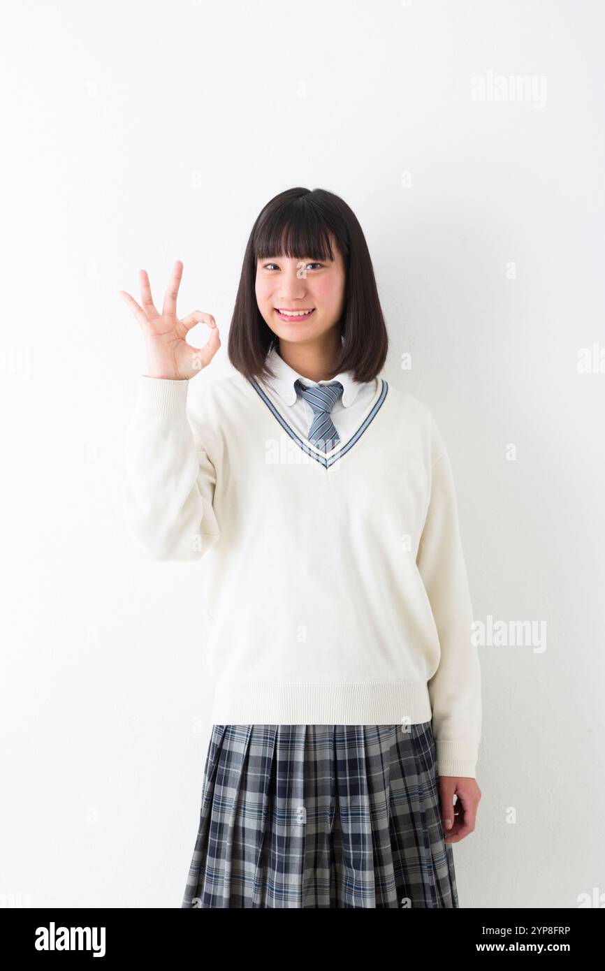 High school girl signing OK Stock Photo - Alamy