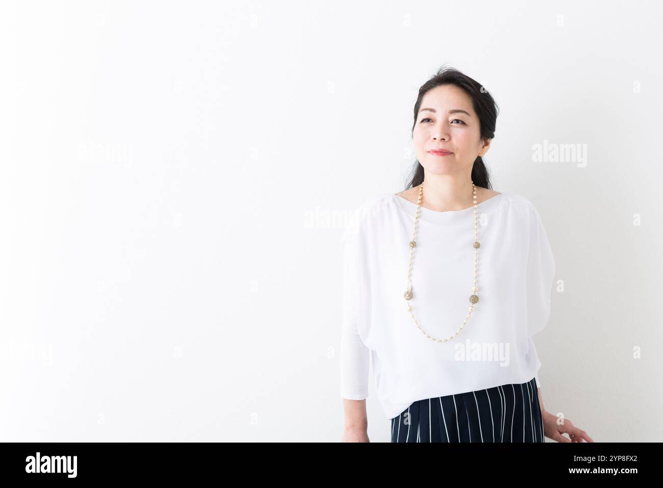 Middle woman standing pose hi-res stock photography and images - Alamy