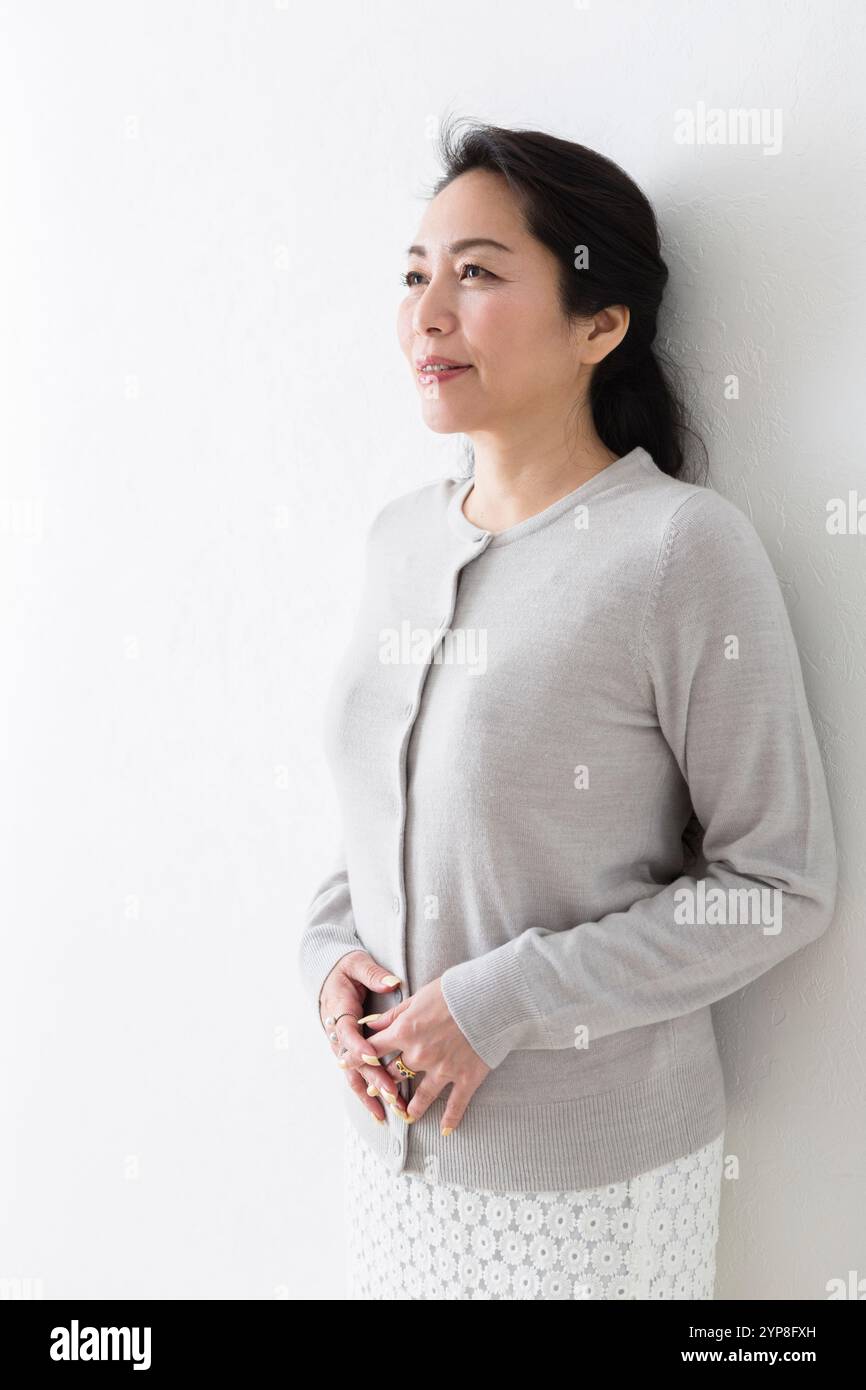 Middle woman standing pose hi-res stock photography and images - Alamy