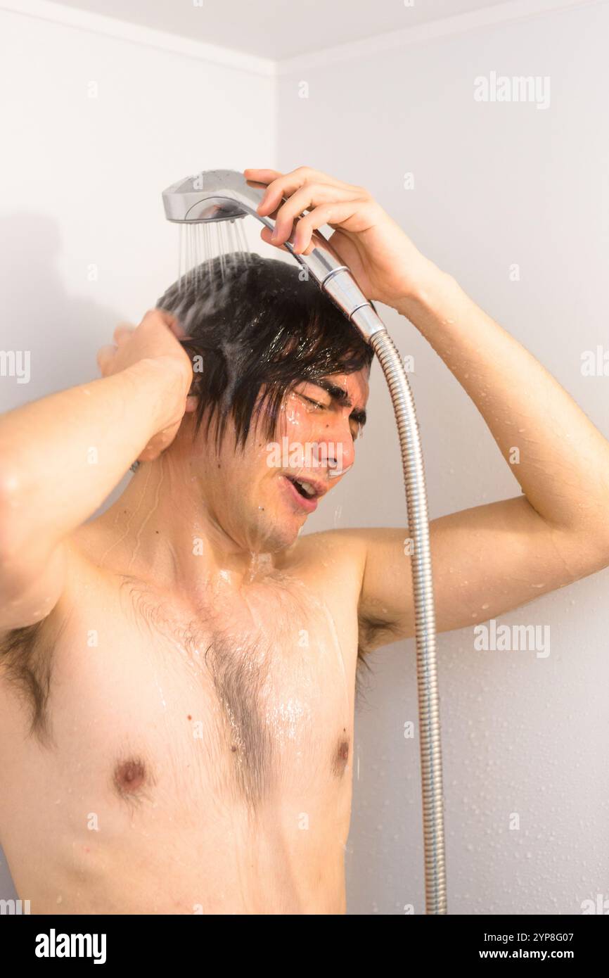 Man taking a shower Stock Photo - Alamy