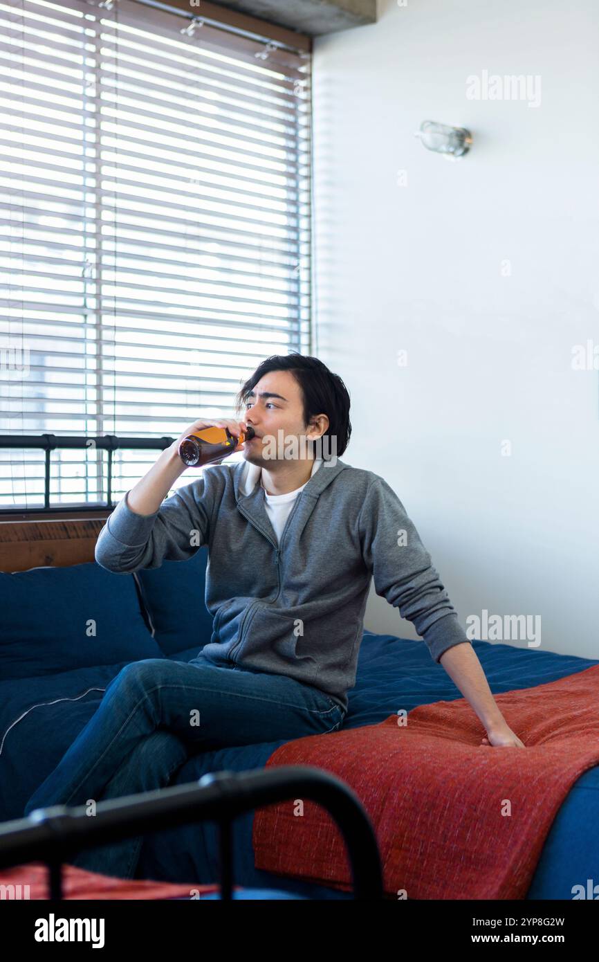 Model drinking beer hi-res stock photography and images - Alamy