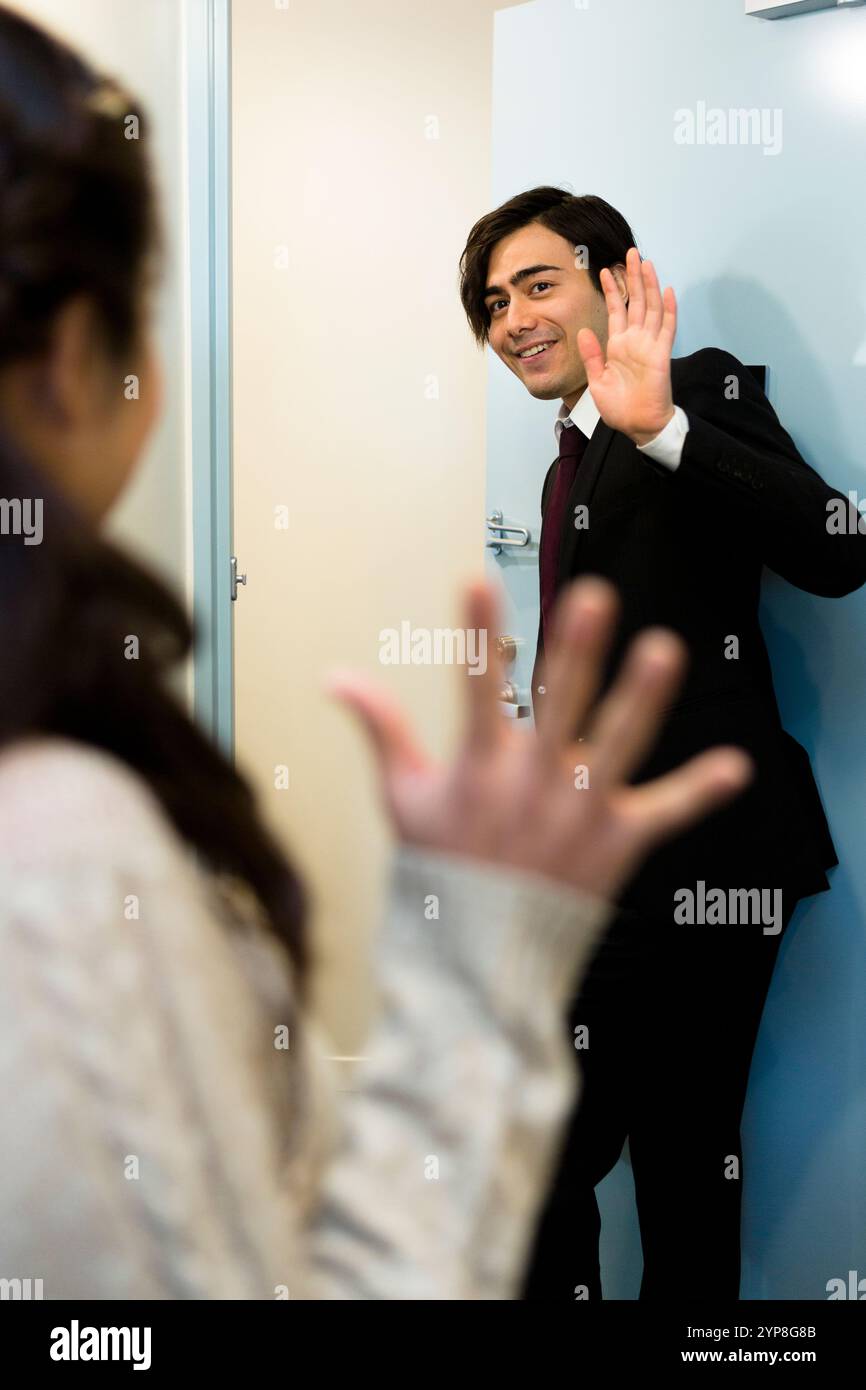 Wife seeing someone off Stock Photo - Alamy