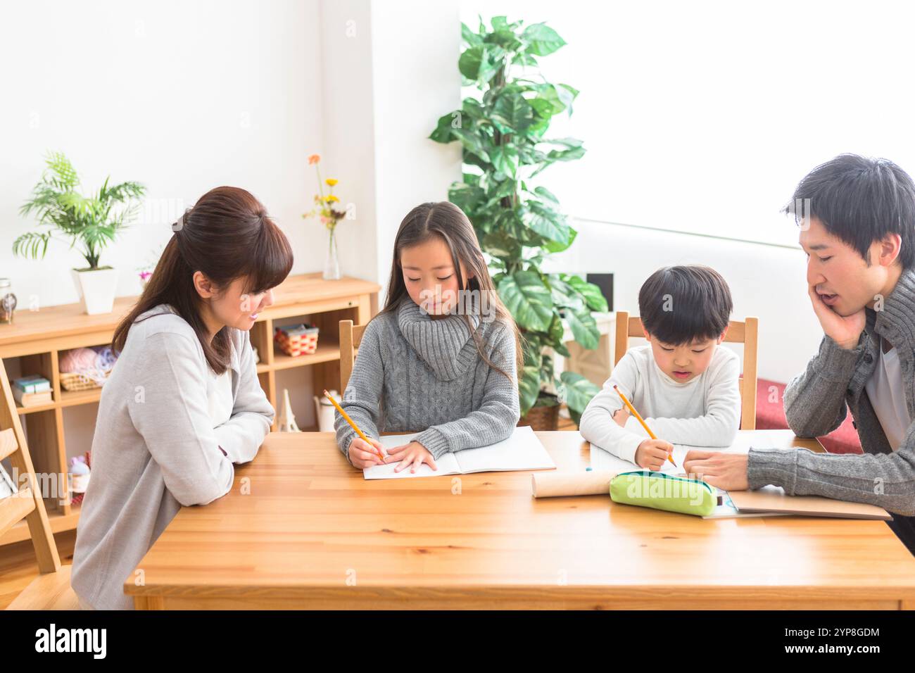 Studying children and parents watching them study Stock Photo - Alamy