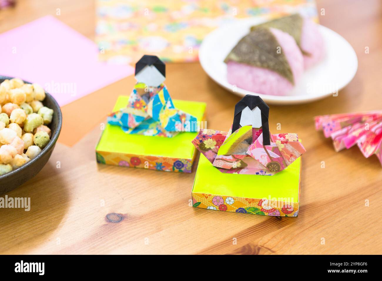 Parent and child doing Origami Stock Photo - Alamy
