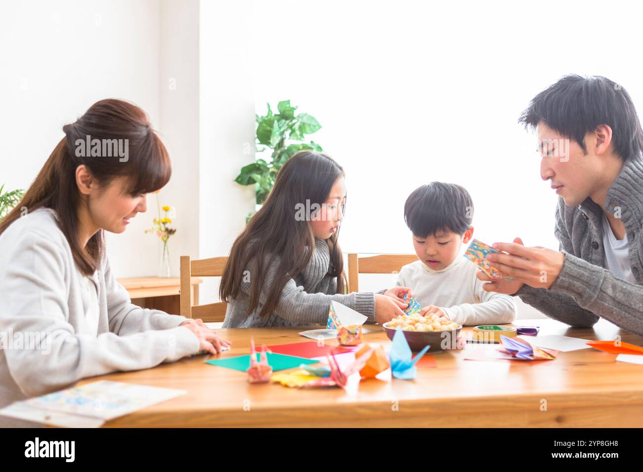 Boy doing origami hi-res stock photography and images - Alamy