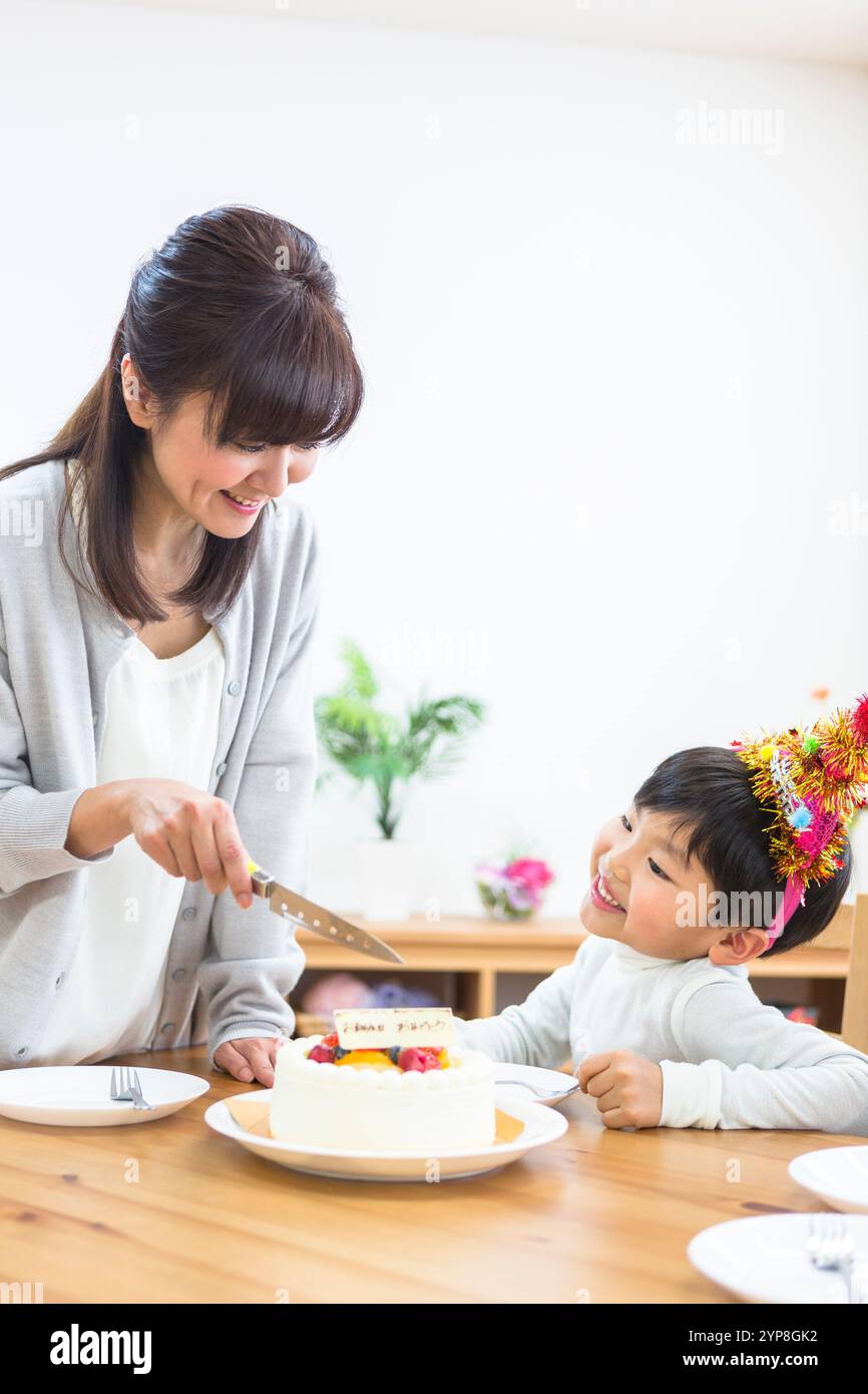 Father son cutting birthday cake hi-res stock photography and images ...
