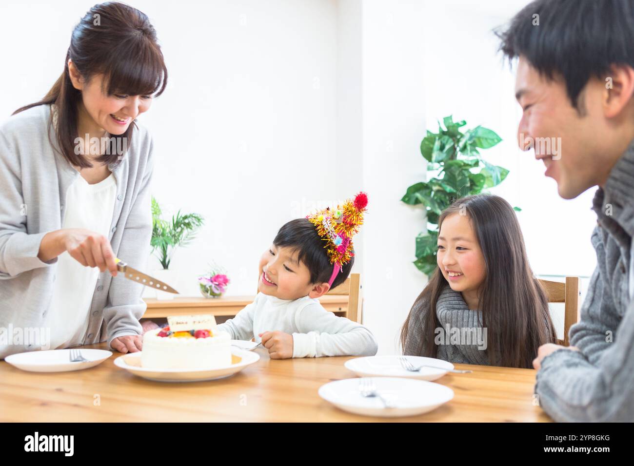 Father son cutting birthday cake hi-res stock photography and images ...