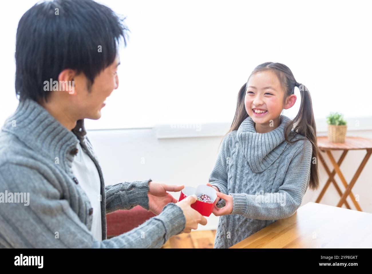 Girl with chocolate heart hi-res stock photography and images - Alamy