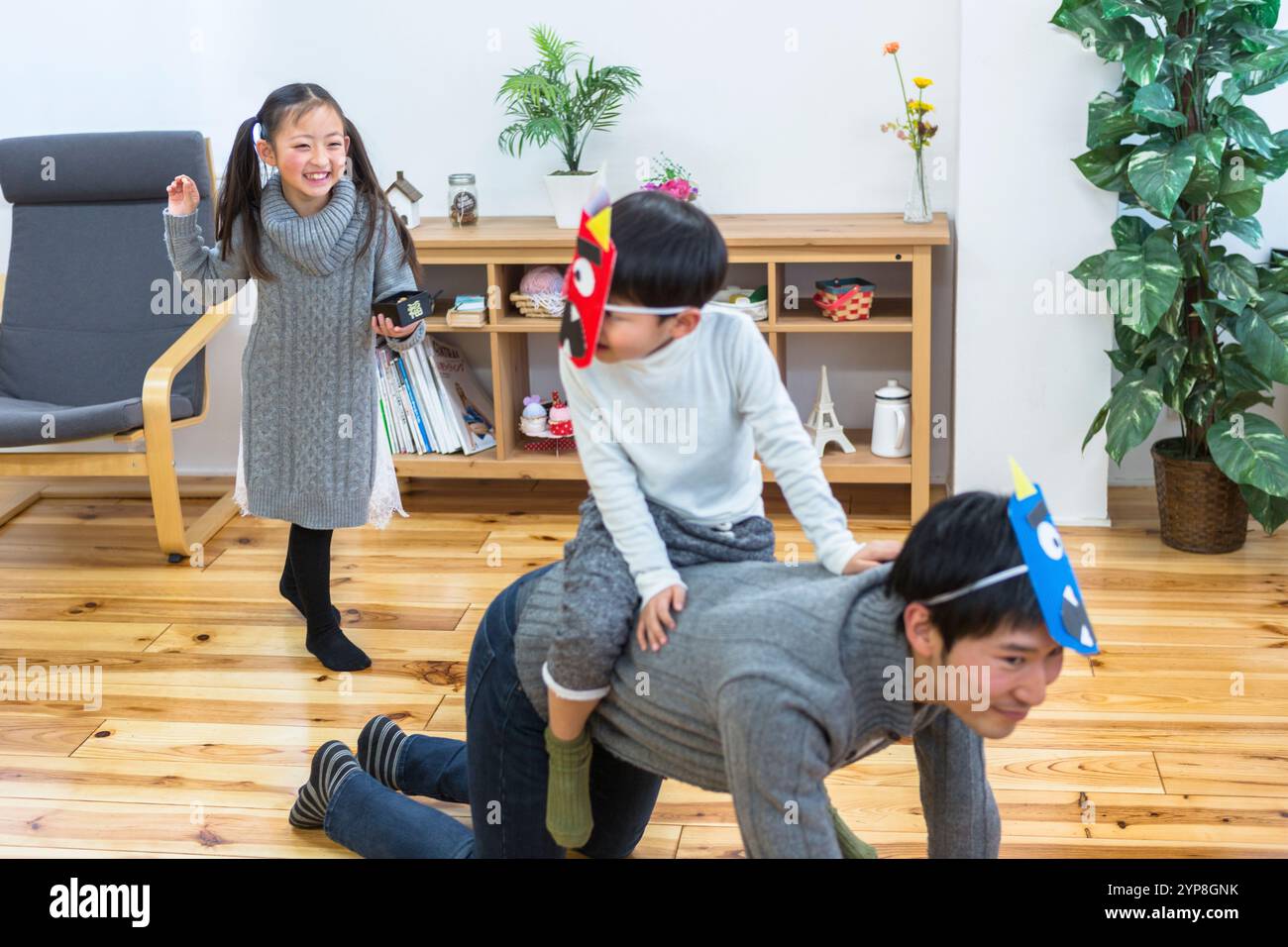 Family members throwing beans on Setsubun Stock Photo - Alamy