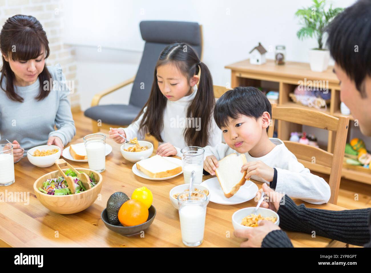 Family around the breakfast table Stock Photo - Alamy