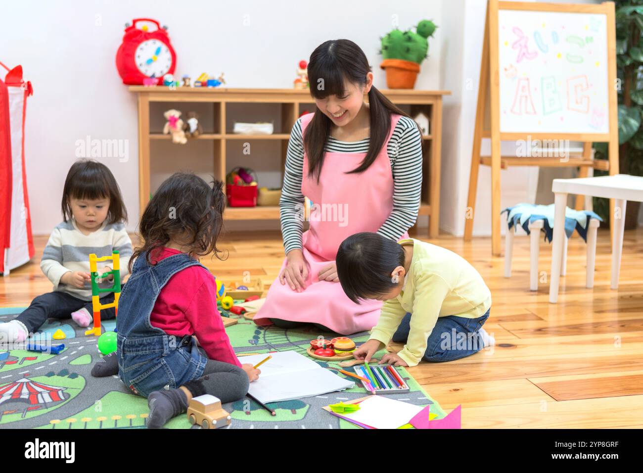 Children playing in nursery school Stock Photo - Alamy