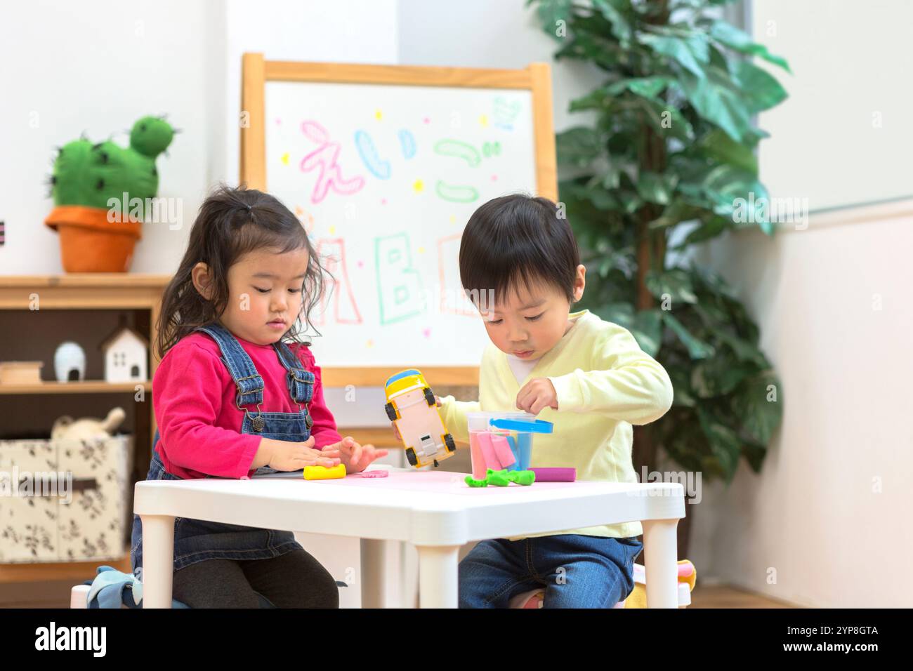 Children playing with clay Stock Photo - Alamy