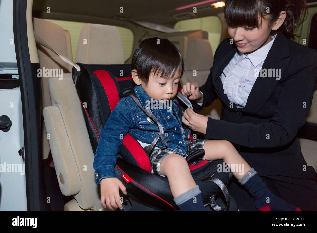 Parents and children out in car Stock Photo - Alamy
