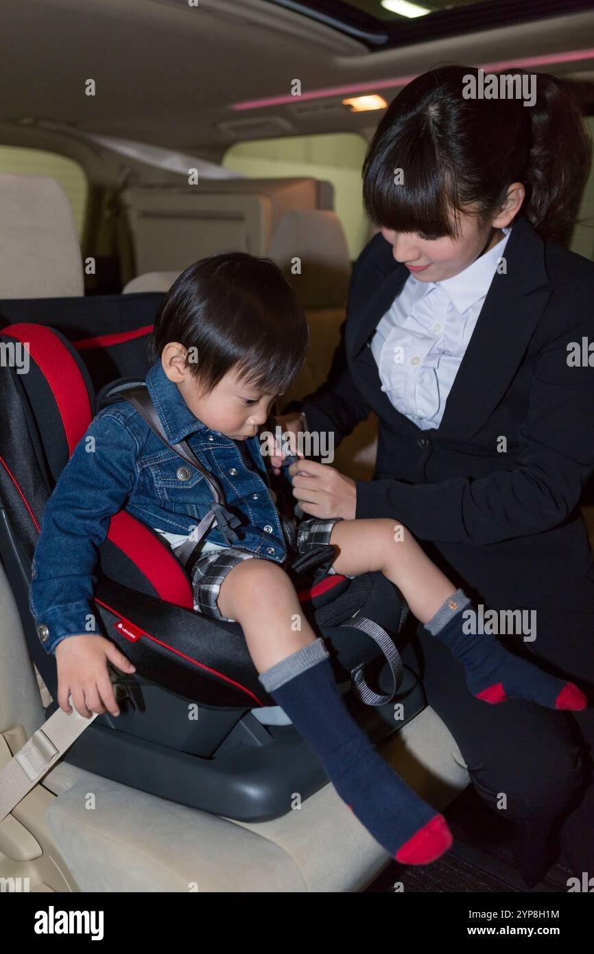Parents and children out in car Stock Photo - Alamy