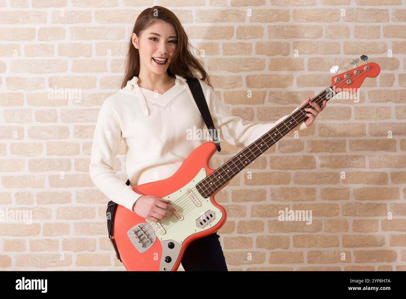 Woman with bass guitar hi-res stock photography and images - Alamy