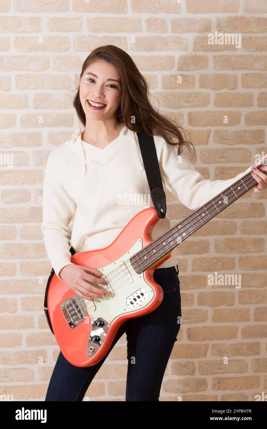 Person playing electric bass hi-res stock photography and images - Alamy