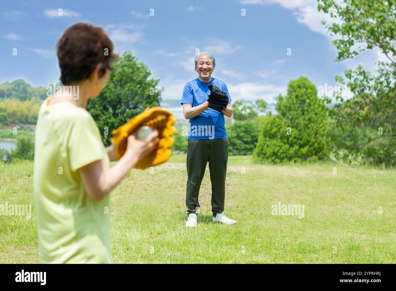 Senior couple playing catch ball Stock Photo - Alamy