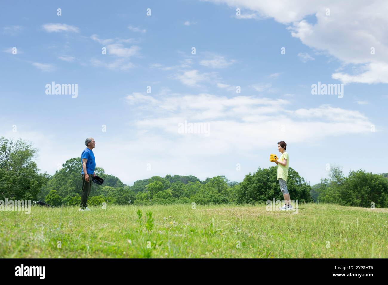 Senior couple playing catch ball Stock Photo - Alamy