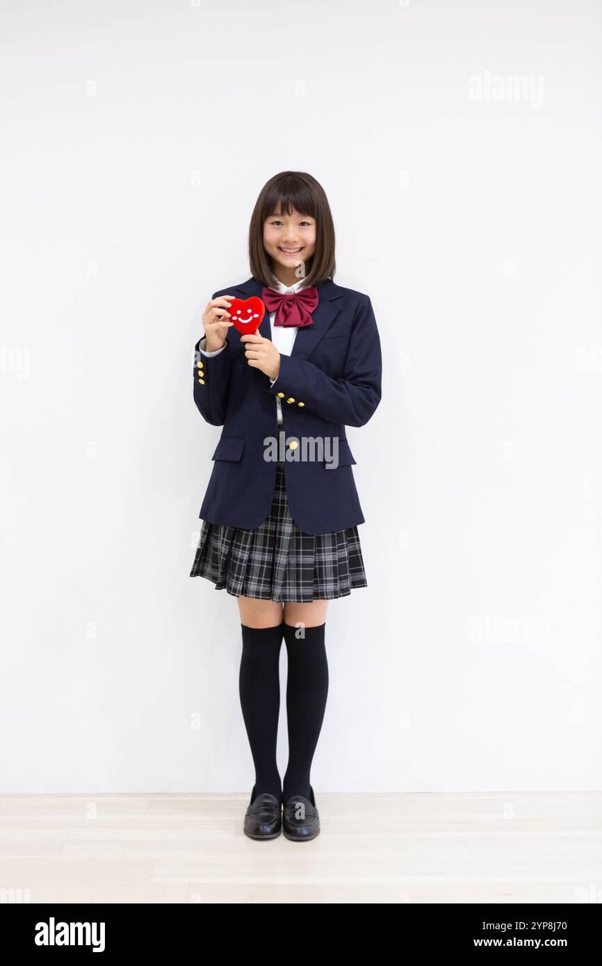 Girl with heart Stock Photo - Alamy
