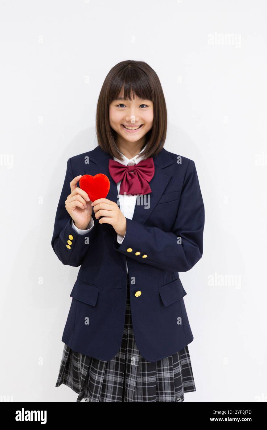 Girl with heart Stock Photo - Alamy
