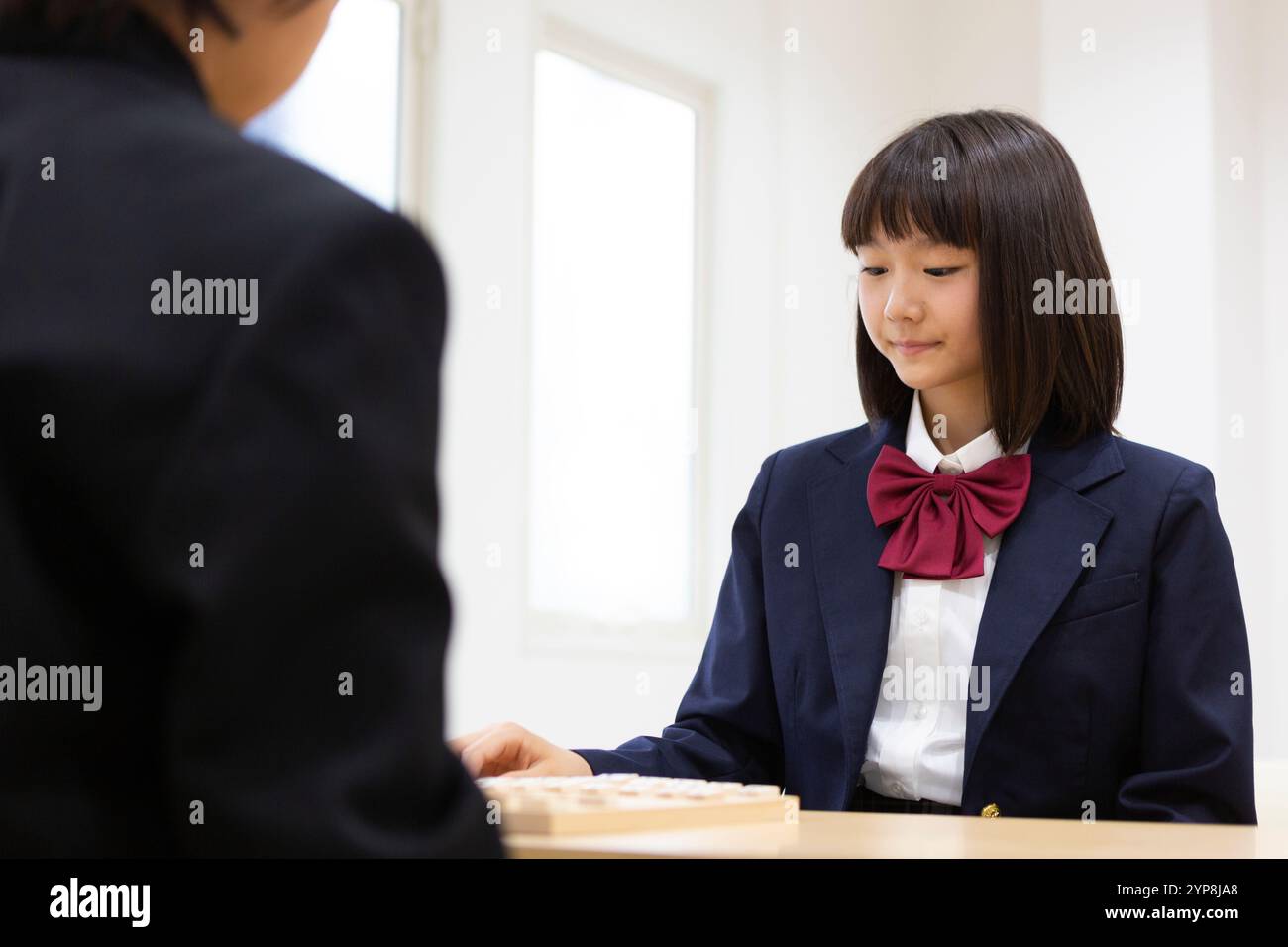Junior high school students playing Go Stock Photo - Alamy