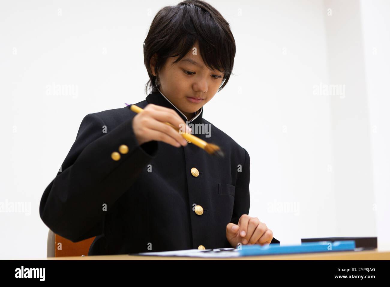 Junior high school student doing calligraphy Stock Photo - Alamy