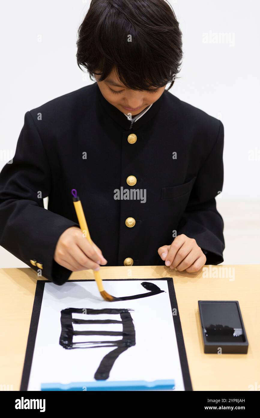 Junior high school student doing calligraphy Stock Photo - Alamy