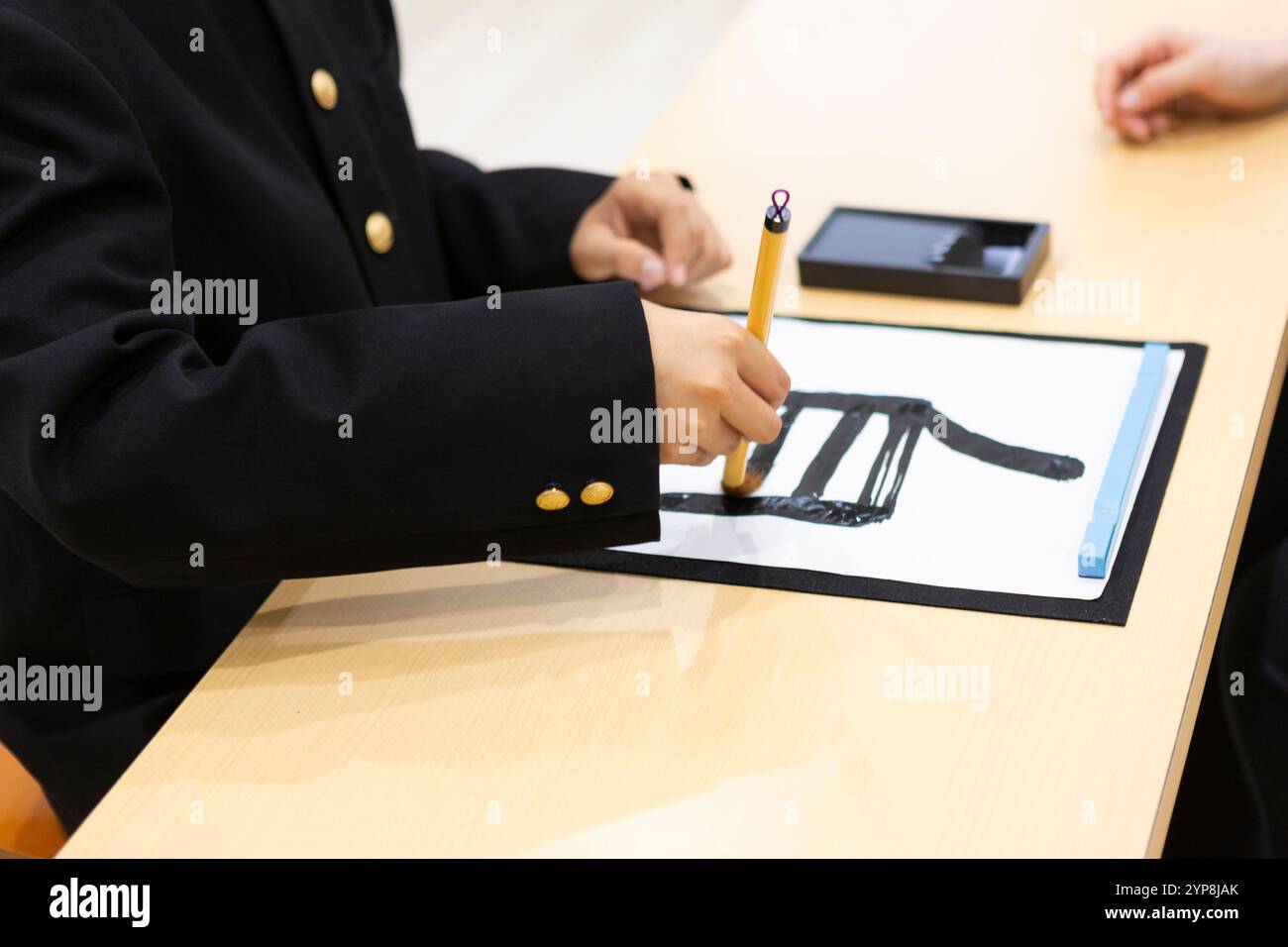 Junior high school student doing calligraphy Stock Photo - Alamy