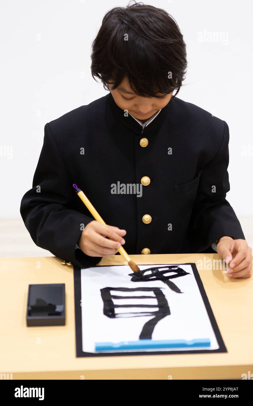 Junior high school student doing calligraphy Stock Photo - Alamy