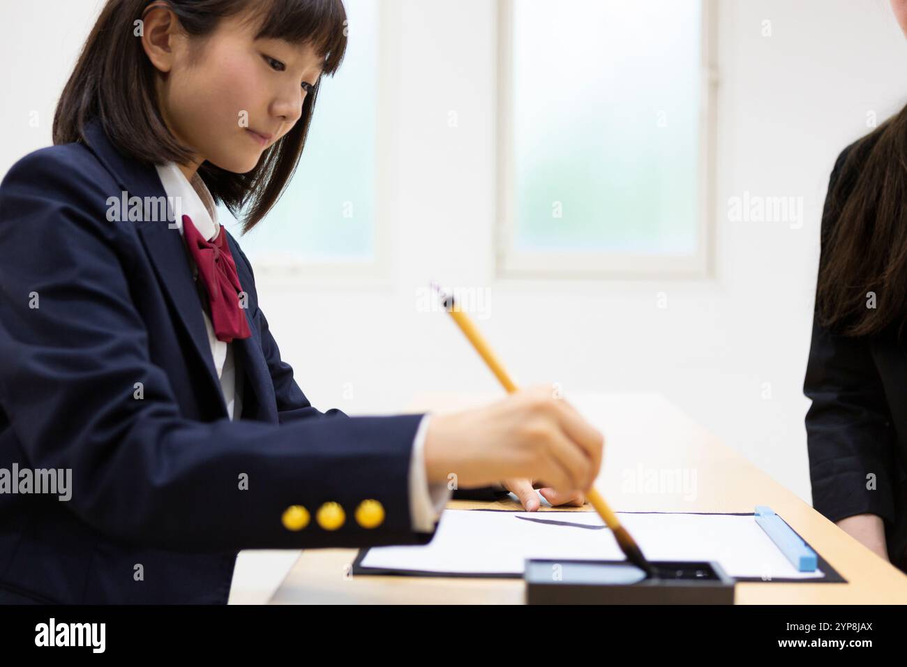 Junior high school student doing calligraphy Stock Photo - Alamy