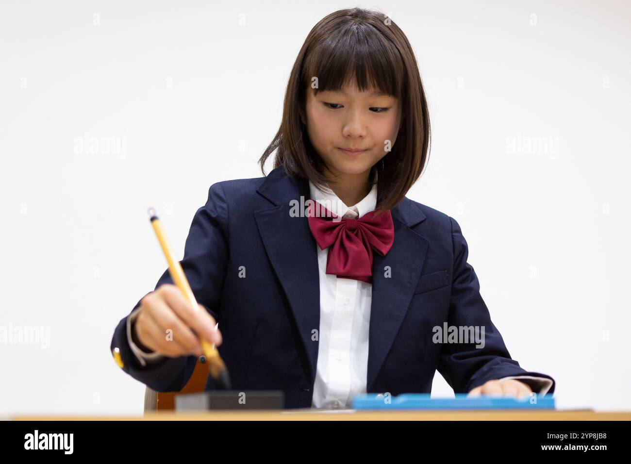 Junior high school student doing calligraphy Stock Photo - Alamy