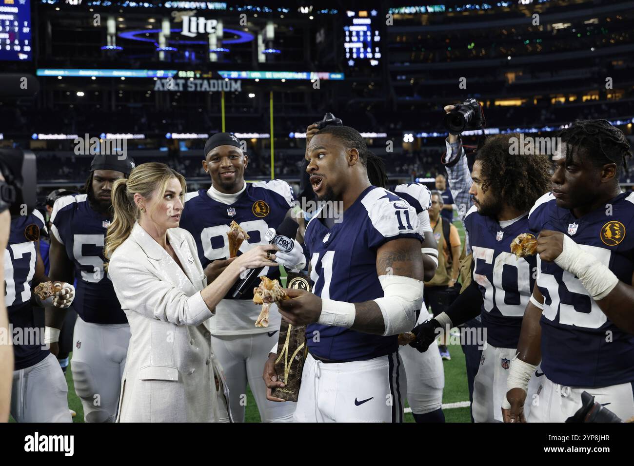 Dallas Cowboys defensive players Micah Parsons (11) and others with ...