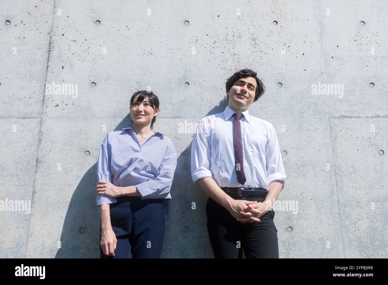 Businessman standing concrete wall hi-res stock photography and images ...