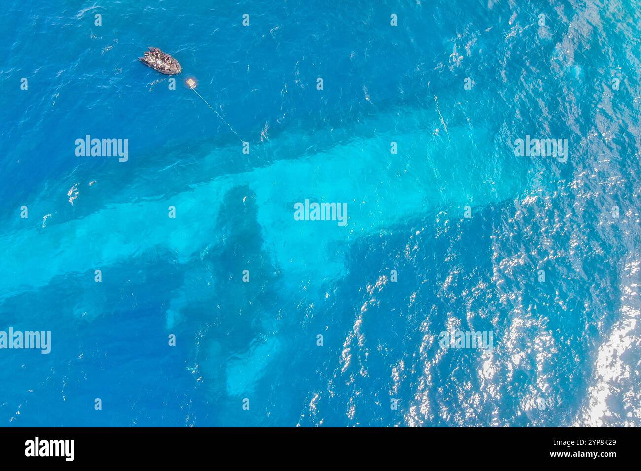 In this photo provided by the New Zealand Defence Force, divers survey ...